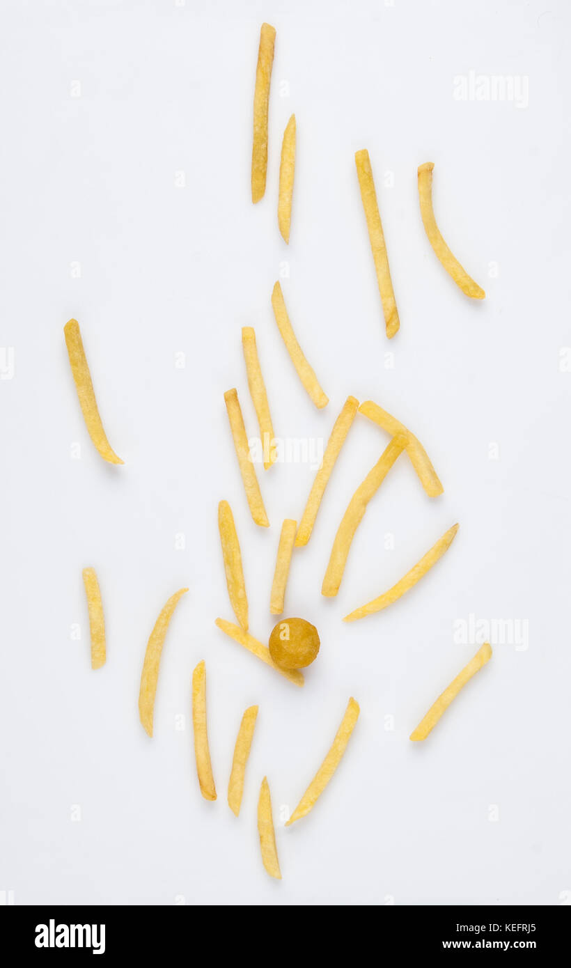 on a white background fried french fries. studio photo of fried french ...