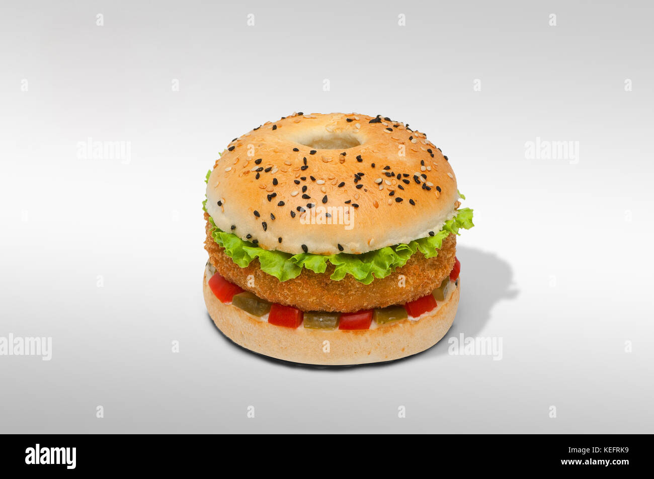 one cheeseburger close-up on a light background Stock Photo - Alamy
