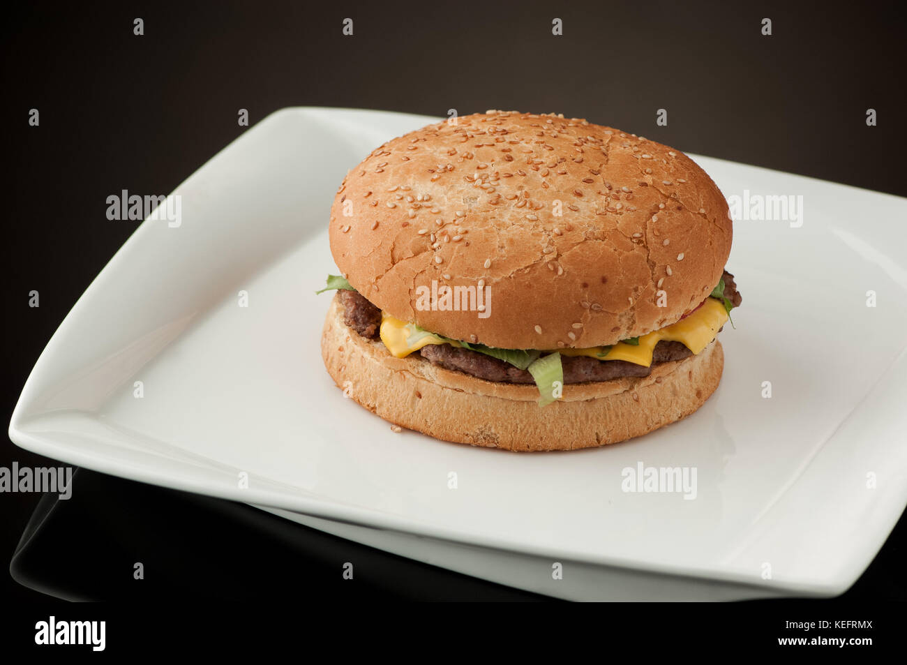 hamburger in a white square plate Stock Photo - Alamy