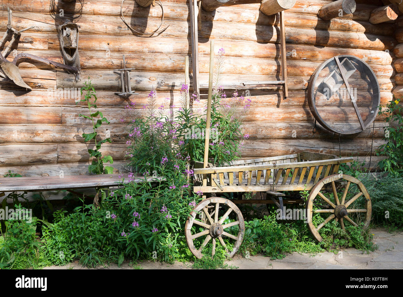 Beautiful old rustic retro wooden cart in house garden Stock Photo - Alamy