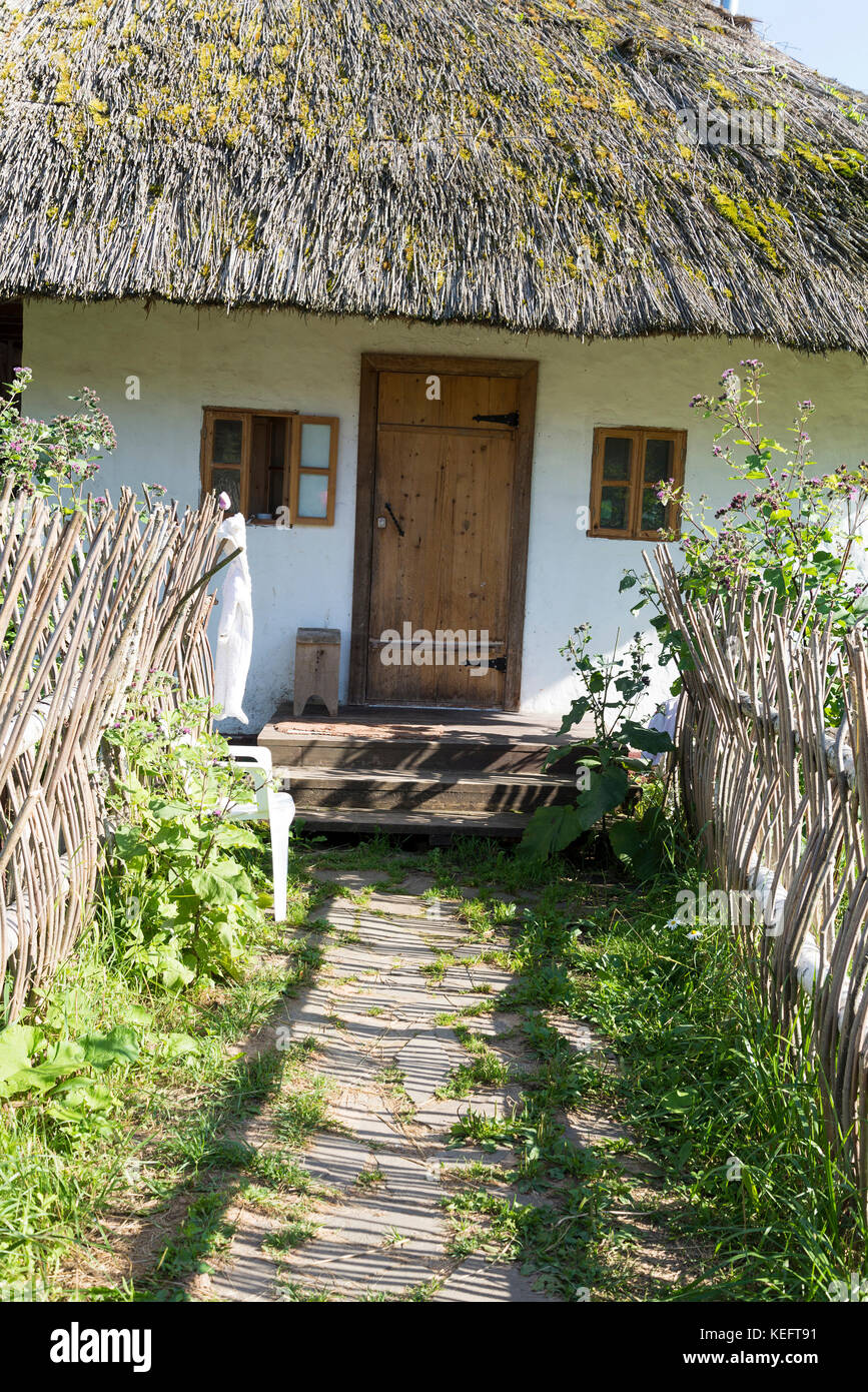 Old houses with thatched roofs in summer Sunny day Stock Photo - Alamy