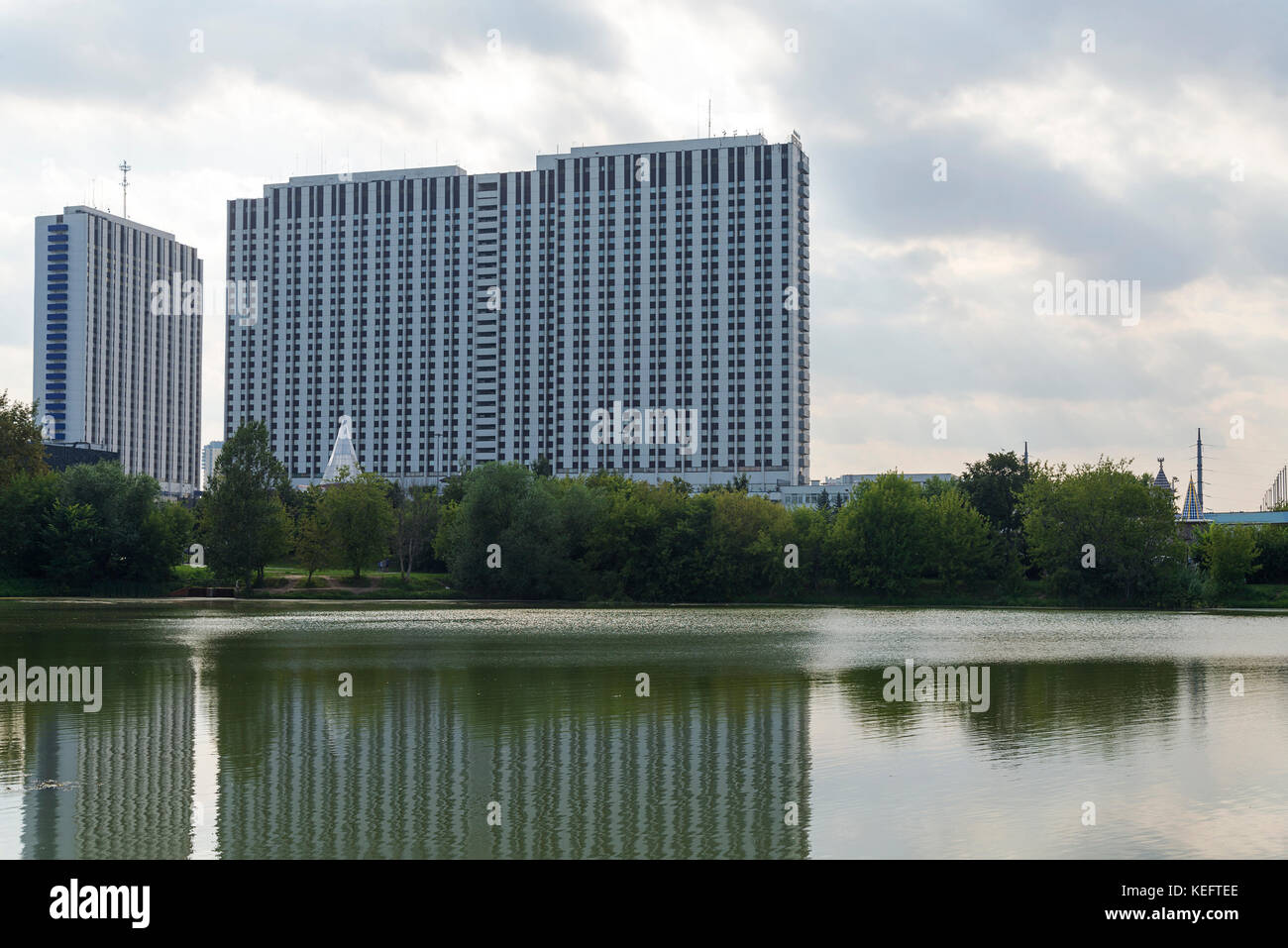 High-rise building by the river in Moscow on a summer day Stock Photo ...