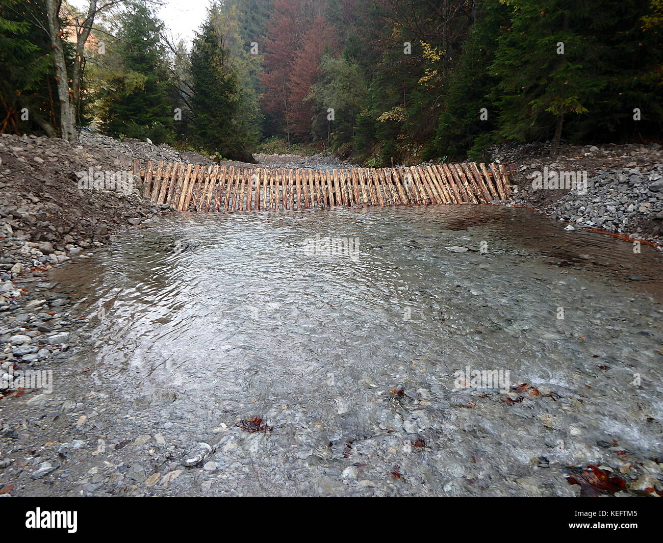 Wooden dam on a mountain river, Traditional structure for floating ...