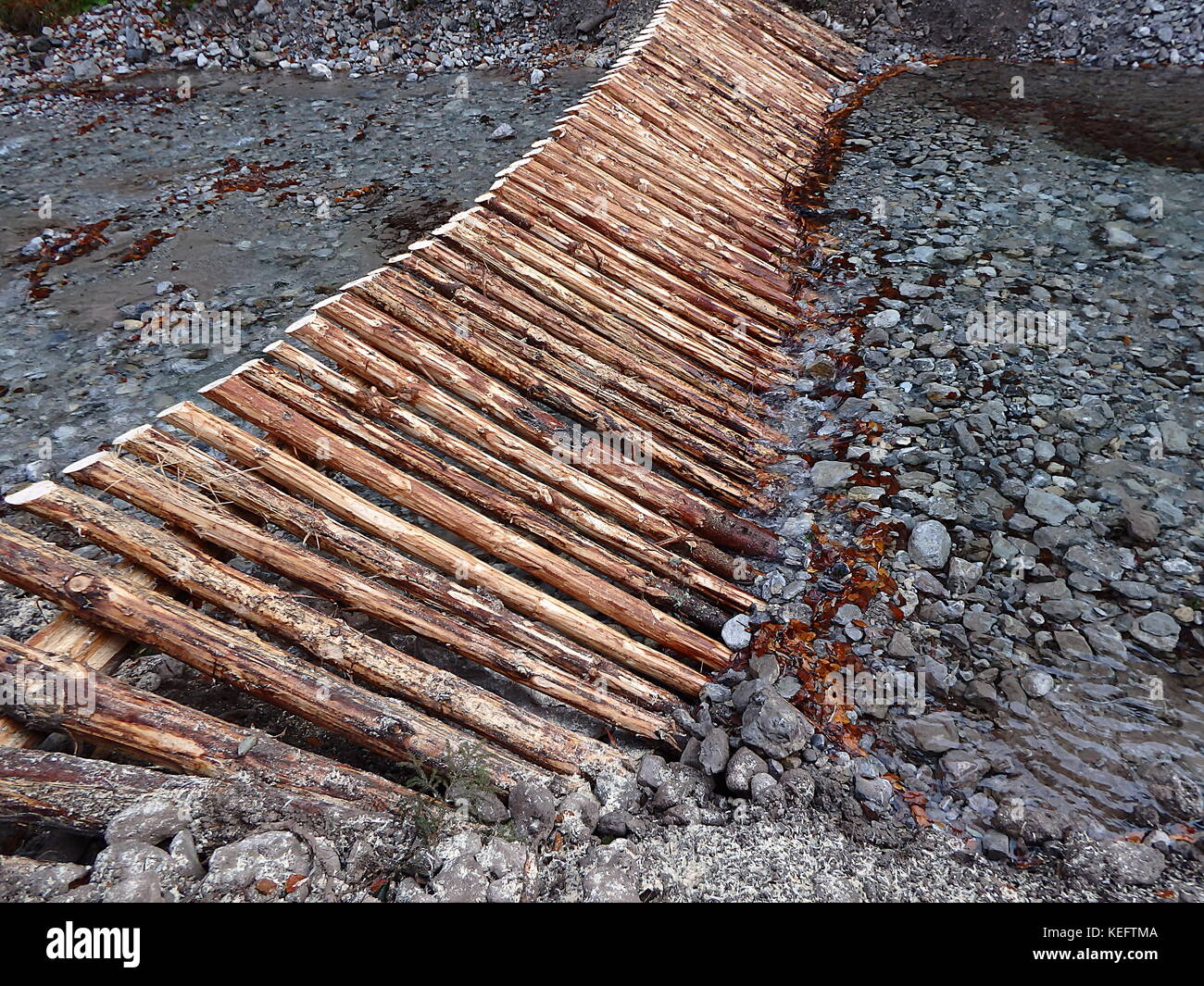 Wooden dam on a mountain river, Traditional structure for floating ...