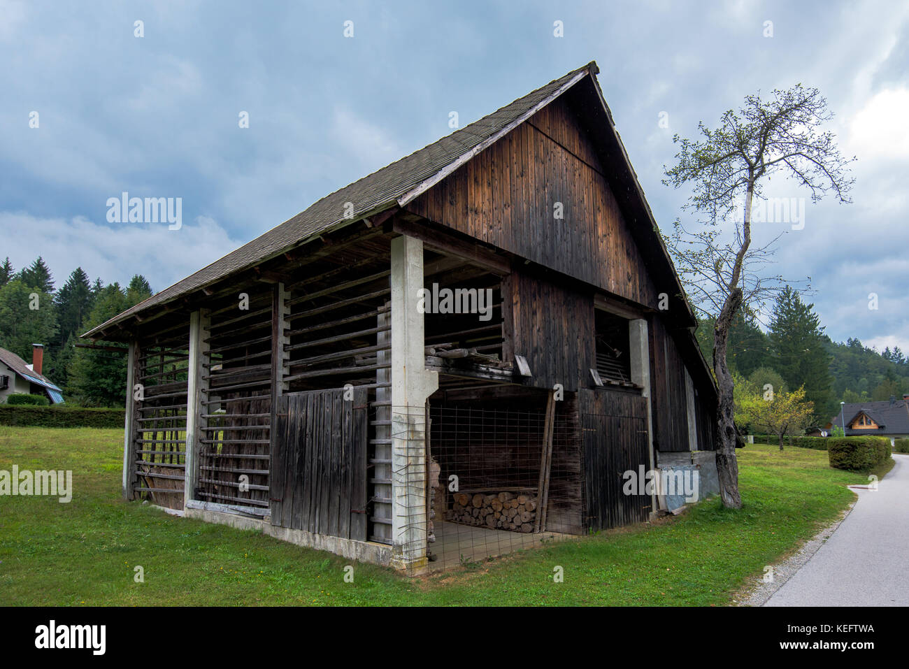 Typical traditional Alpine barn shed located in Slovenian touristic ...