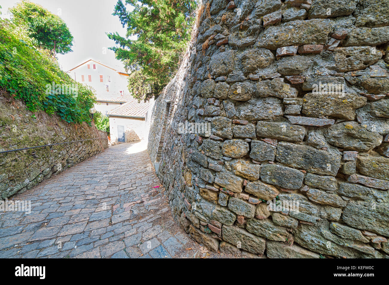 stone buildings in street of Volterra, Italy Stock Photo - Alamy