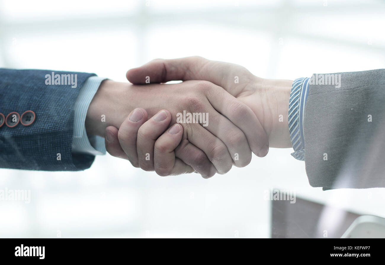 handshake of business partners after discussion of the financial Stock ...