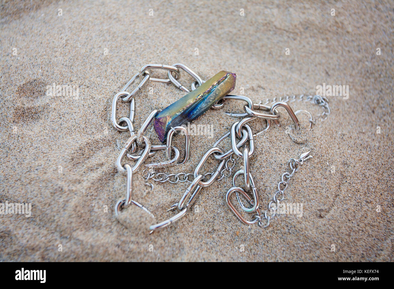 Necklace in the sand Stock Photo - Alamy
