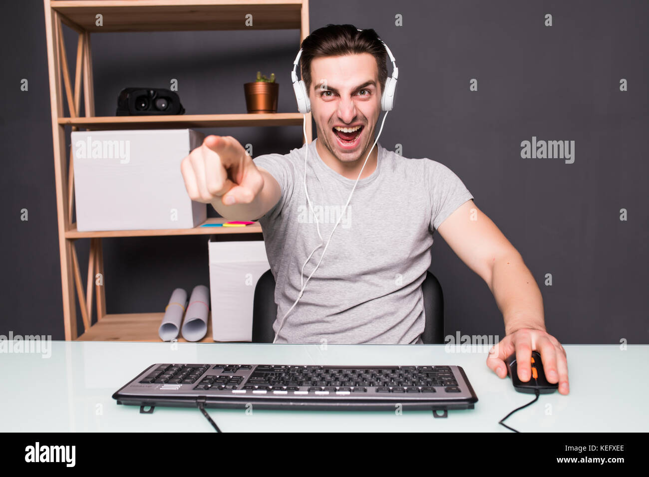 technology, gaming, let's play and people concept - young man or hacker ...