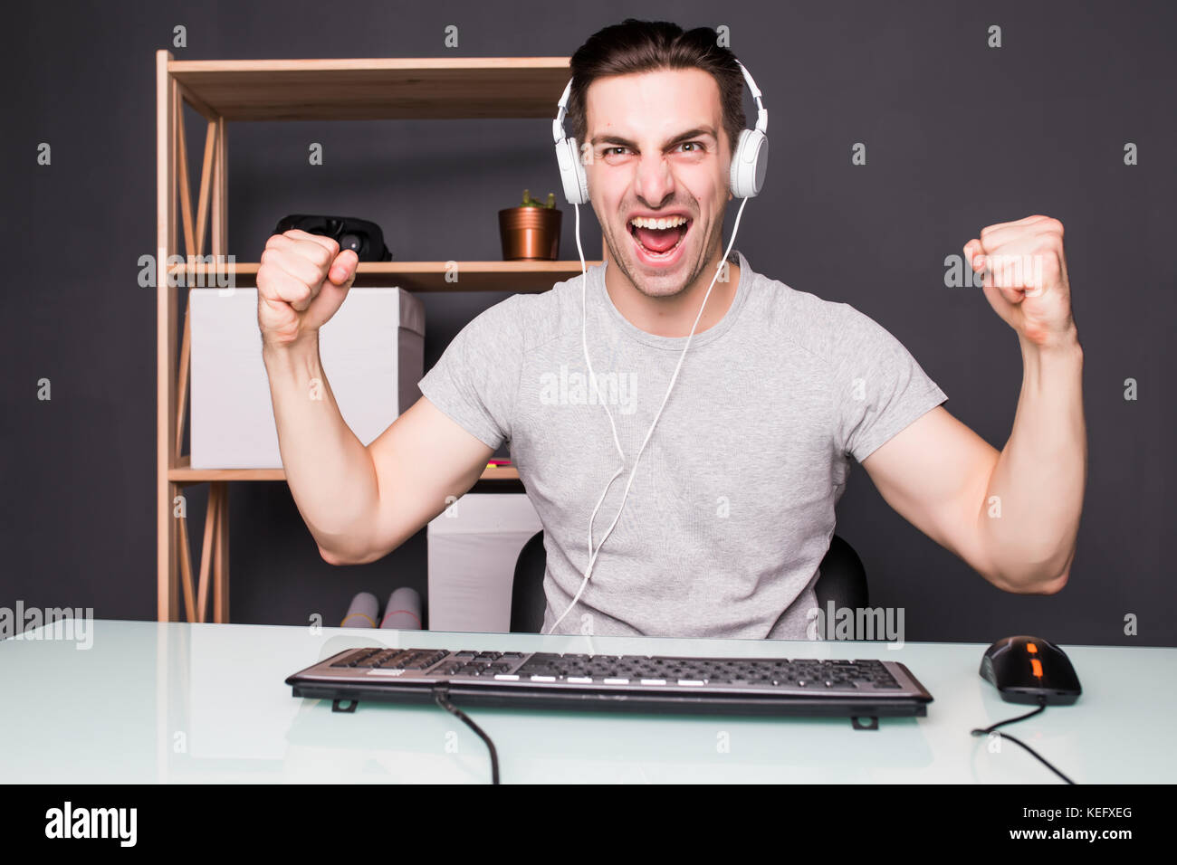 Back view young gamer winning hi-res stock photography and images - Alamy