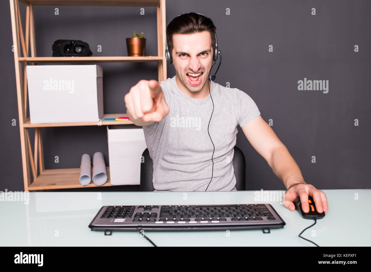 technology, gaming, let's play and people concept - young man or hacker ...