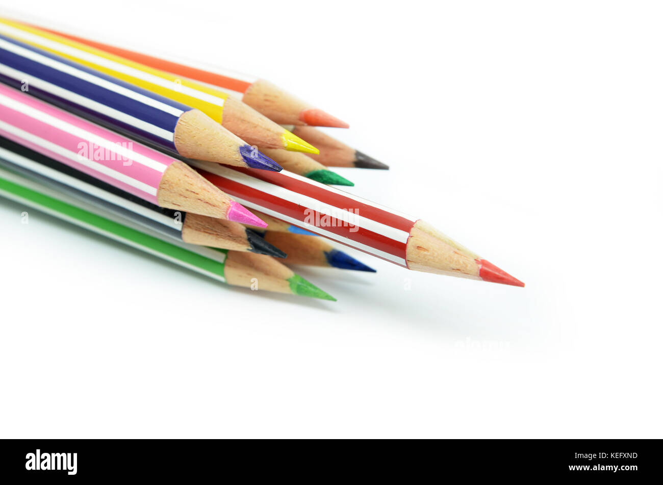 Red color pencil standing out from others Stock Photo - Alamy