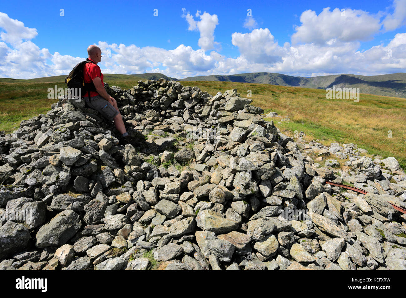 Walker at the summit of Selside fell, Lake District National Park ...