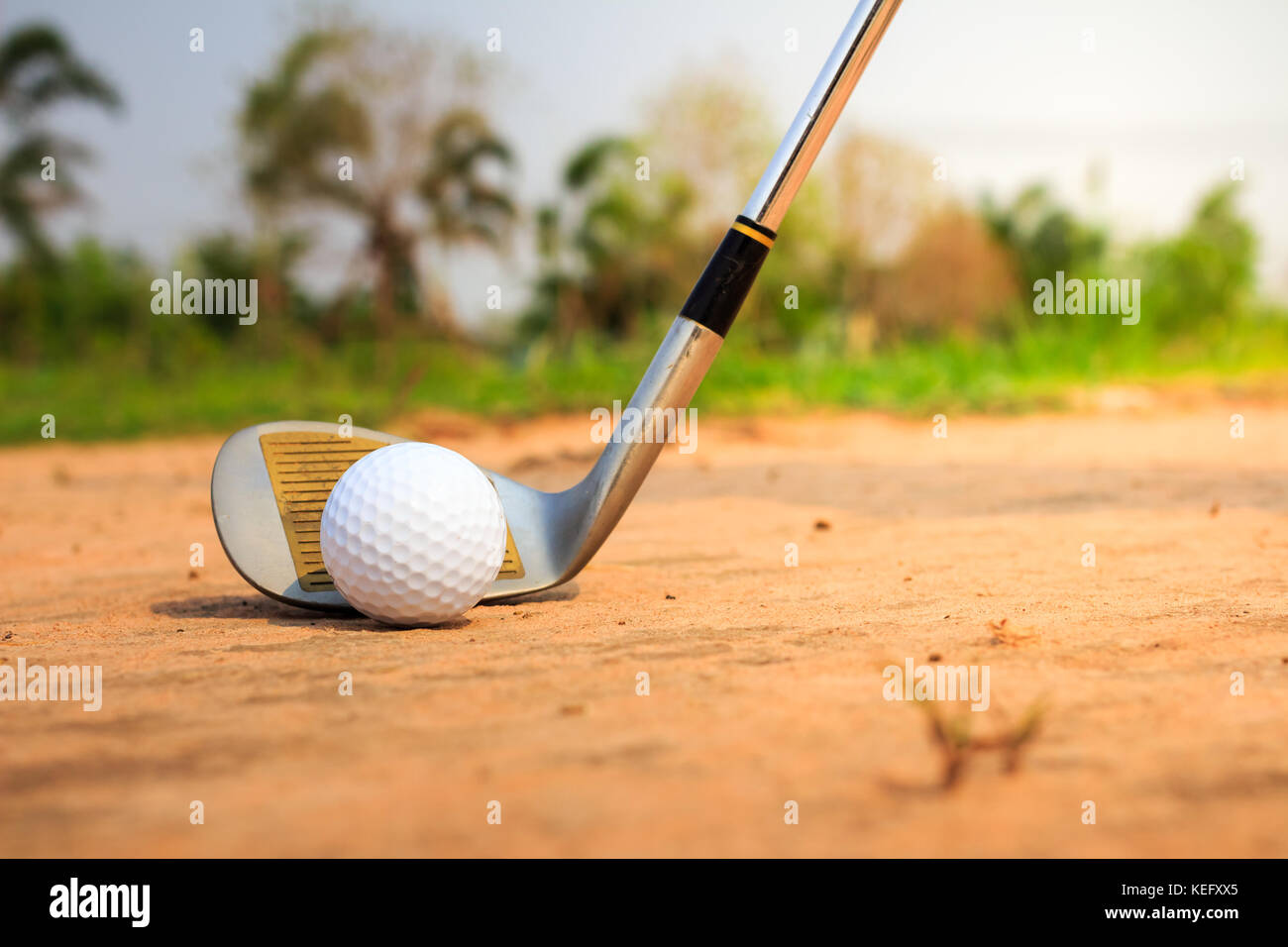 Golf Ball in Trap with Sand Stock Photo - Alamy