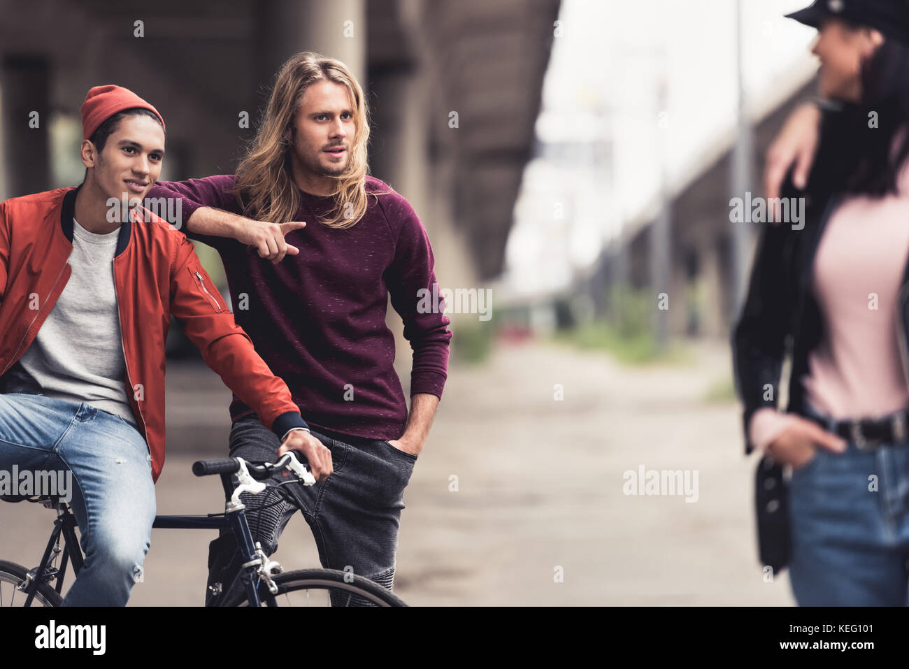 young handsome men flirting with stylish woman passing by Stock Photo ...