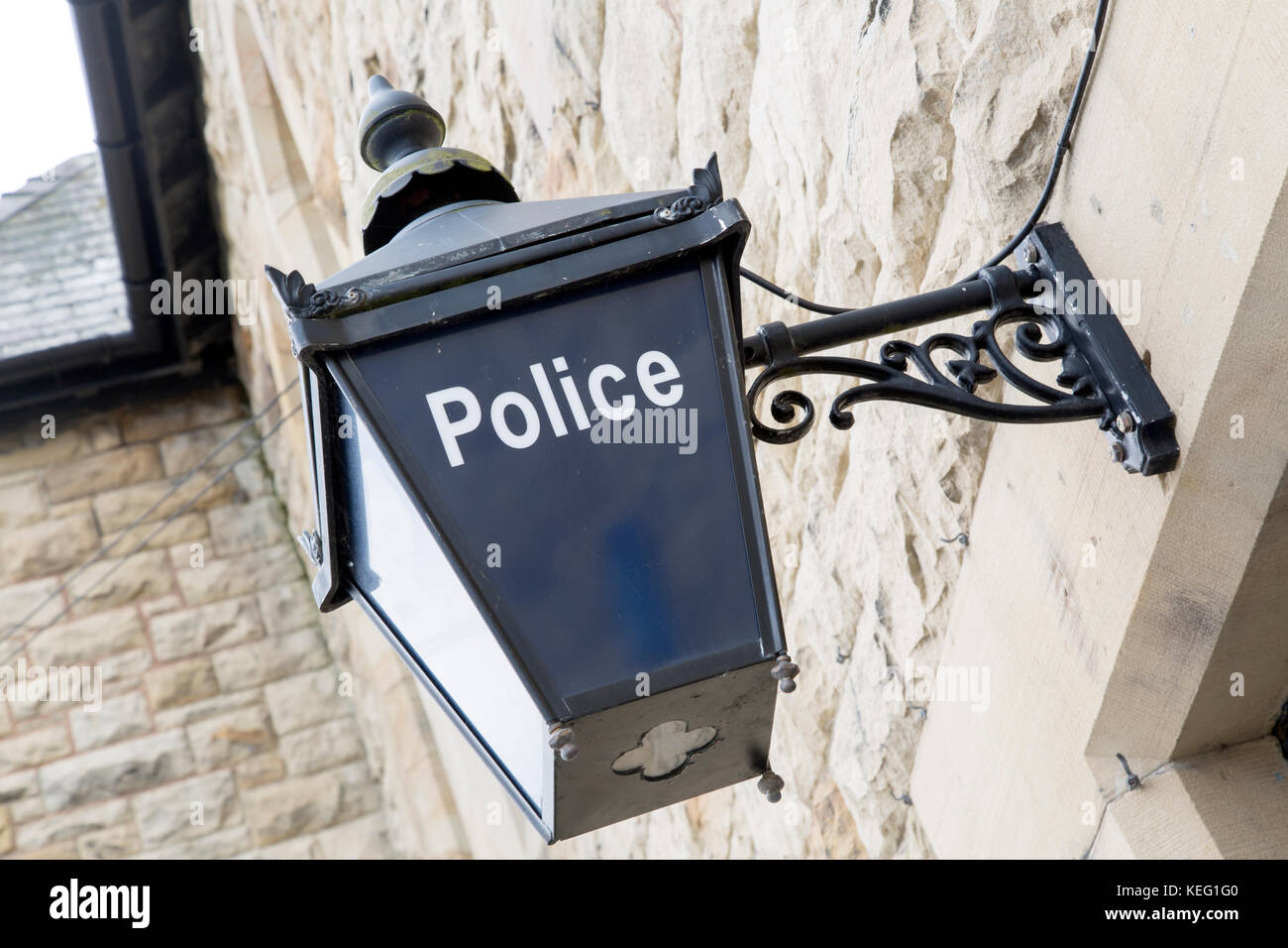 Blue Police Sign on Stone Wall Stock Photo - Alamy