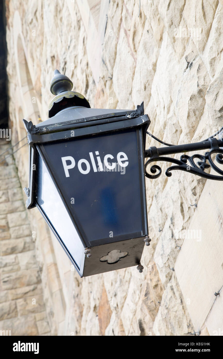 Blue Police Sign on Stone Wall Stock Photo - Alamy