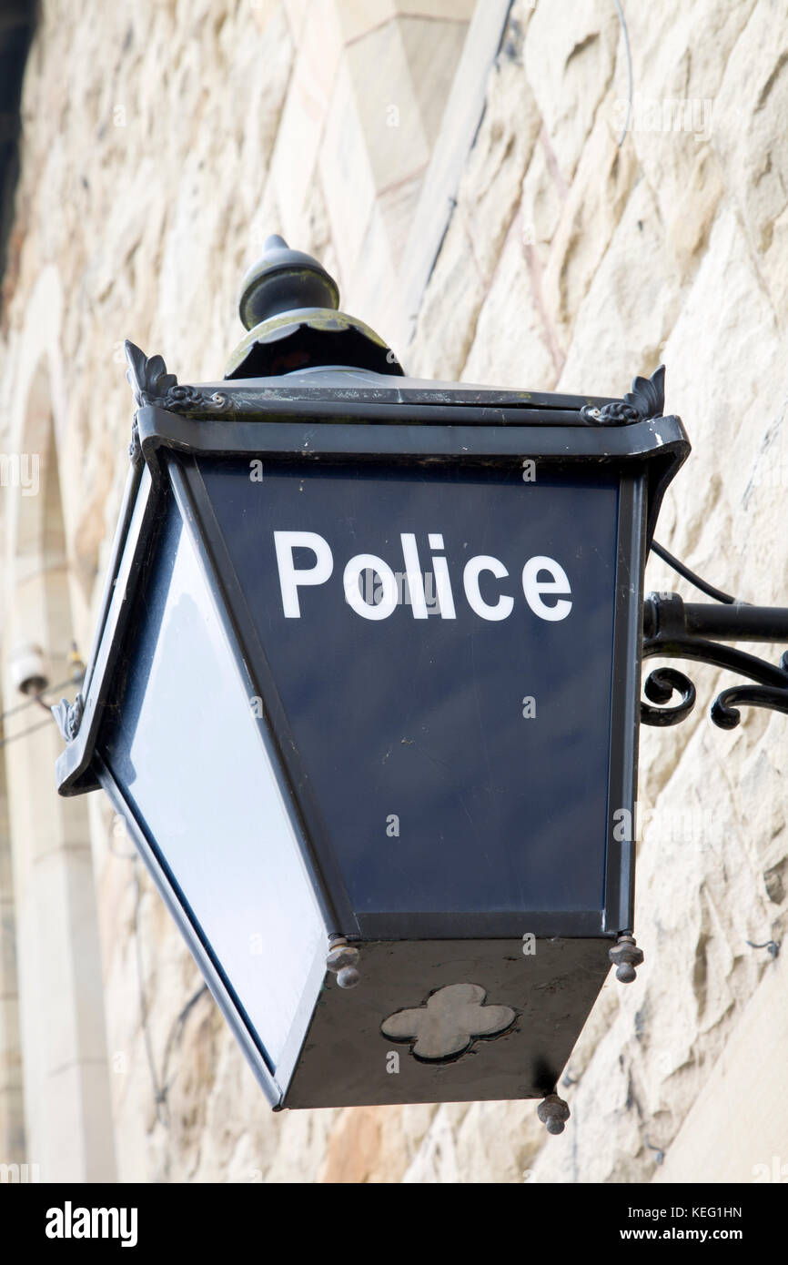 Blue Police Sign on Stone Wall Stock Photo - Alamy