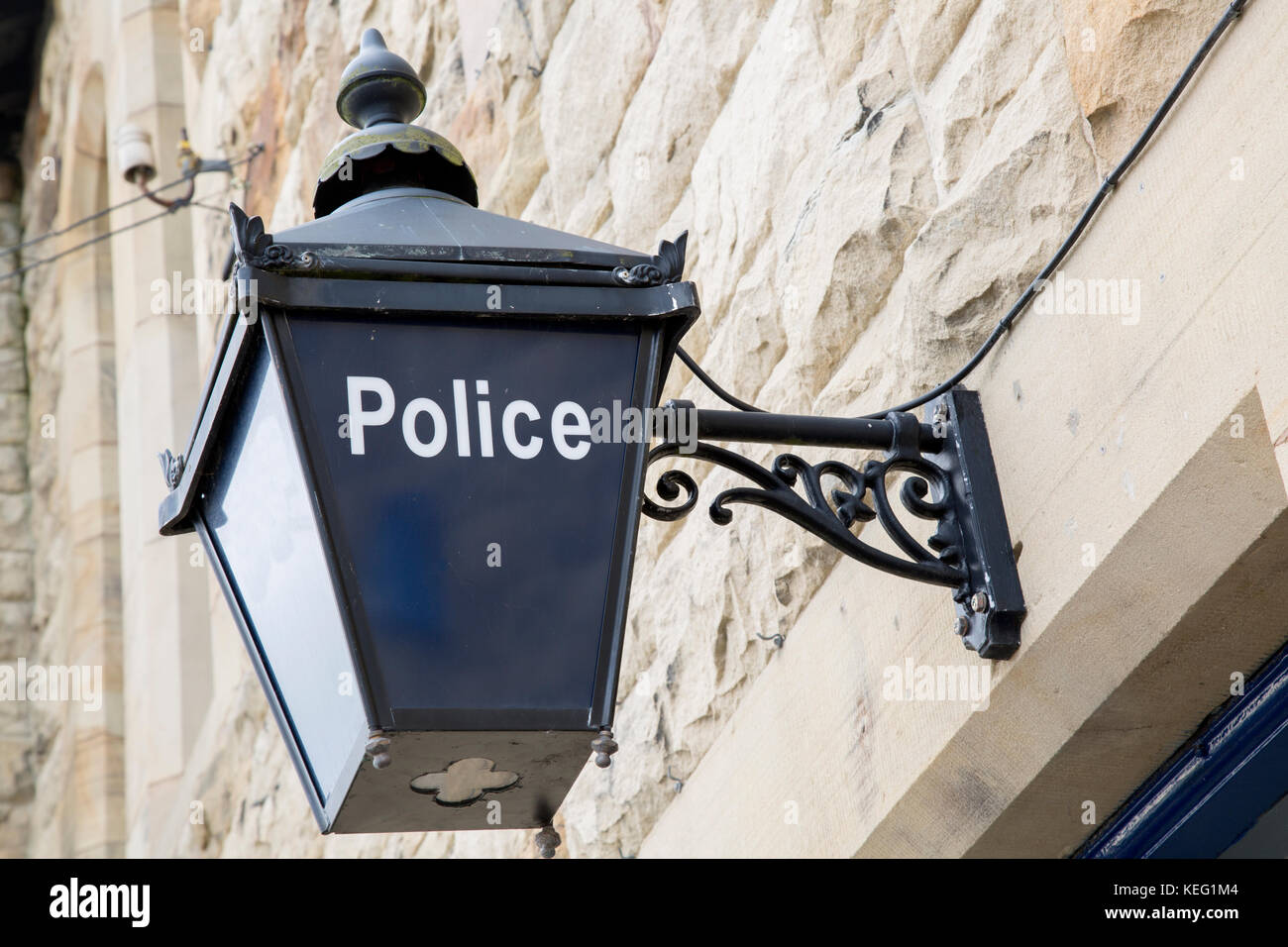 Blue Police Sign on Stone Wall Stock Photo - Alamy