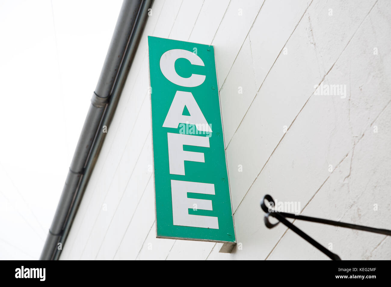 Green Cafe Sign on Building Facade Stock Photo - Alamy