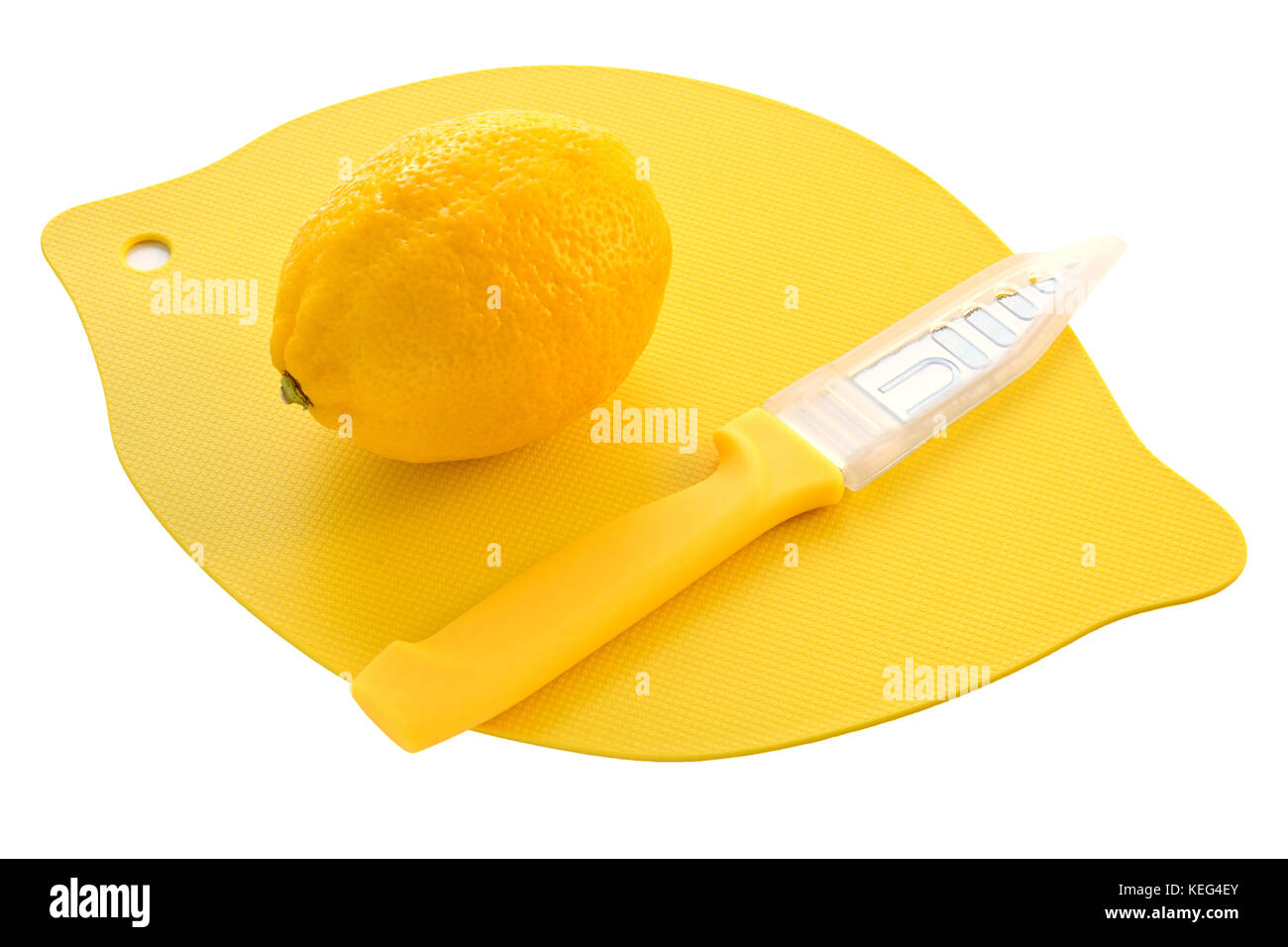 Fresh lemon on yellow lemon shaped cutting board with yellow knife ...