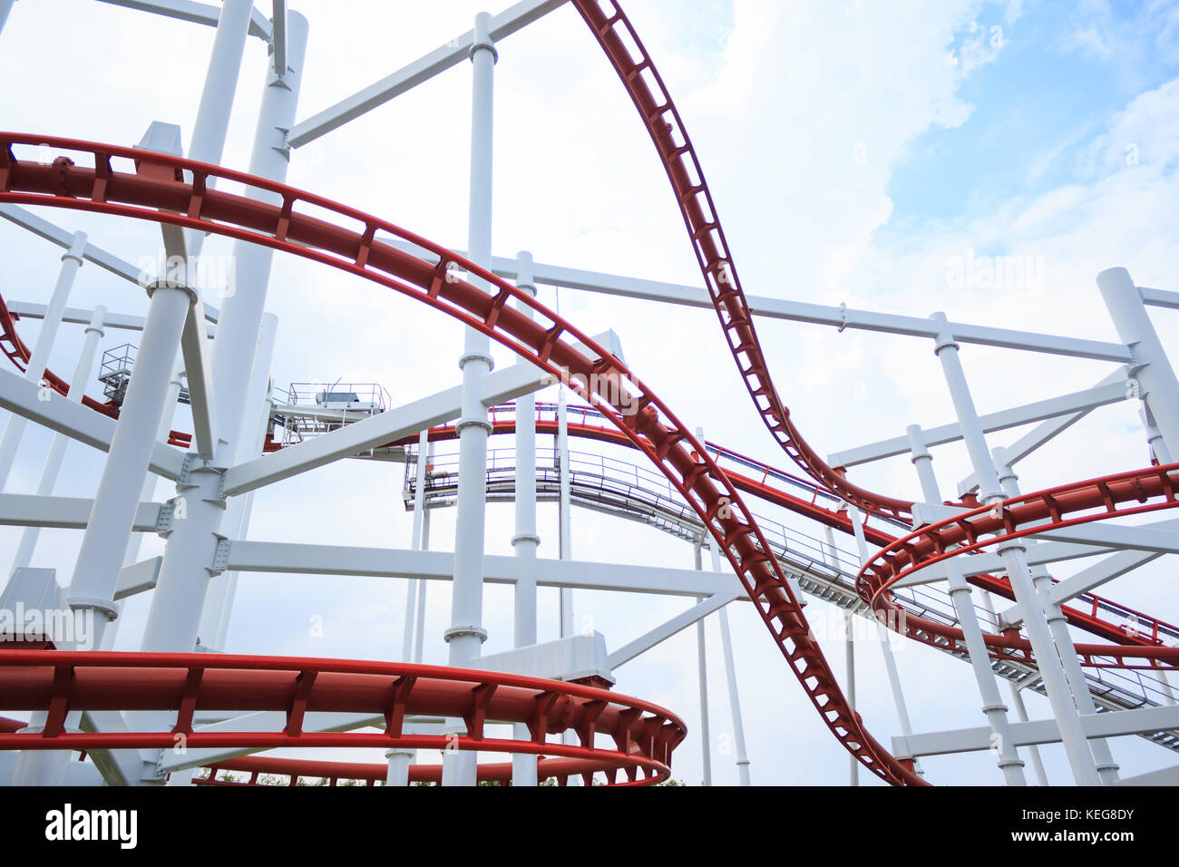 Roller coaster rail loop over cloudy sky Stock Photo - Alamy