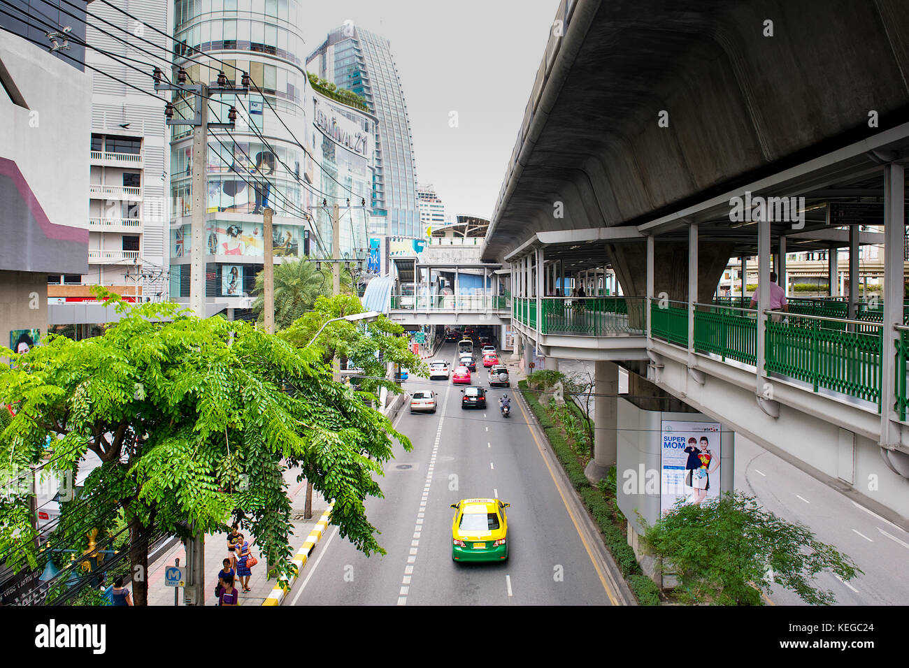 Looking down onto the road from the overhead walkway between sky train ...