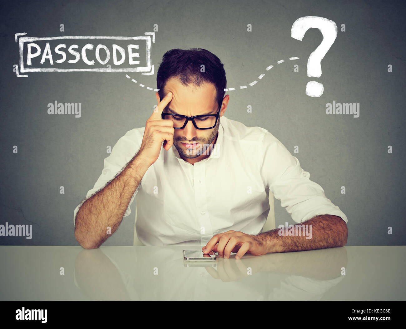 Desperate young man trying to log into his smart phone forgot password ...