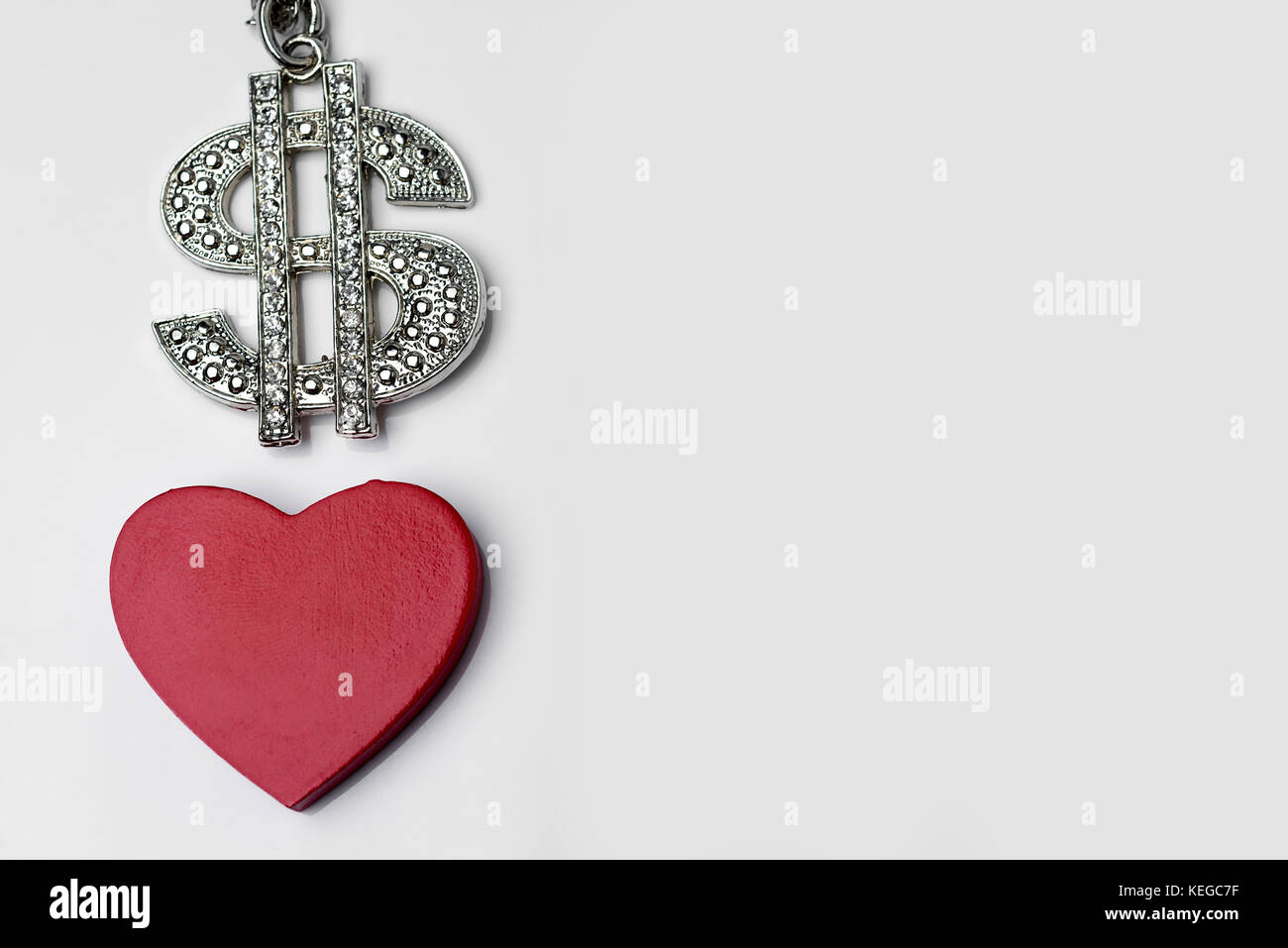 The dollar sign and red heart on a white background Stock Photo - Alamy