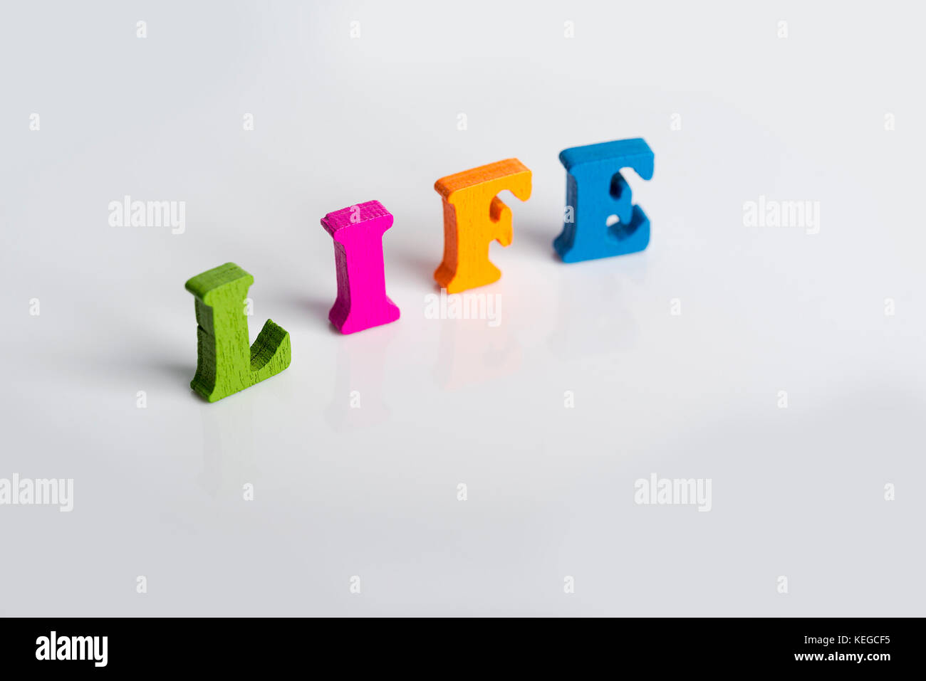 The word from multicolored letters on a white background Stock Photo ...