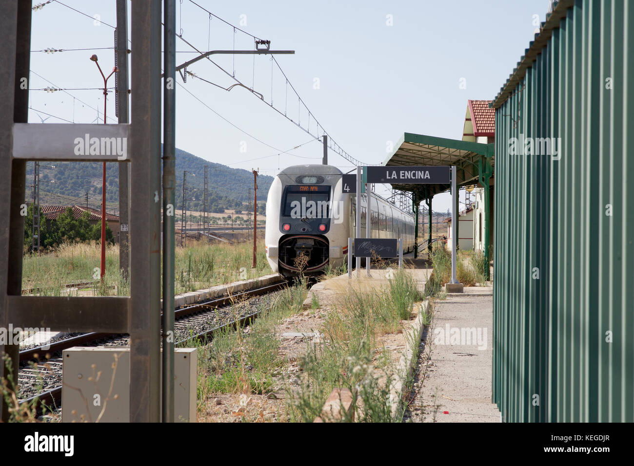 A passenger train at the railway station at La Encina, Province of ...