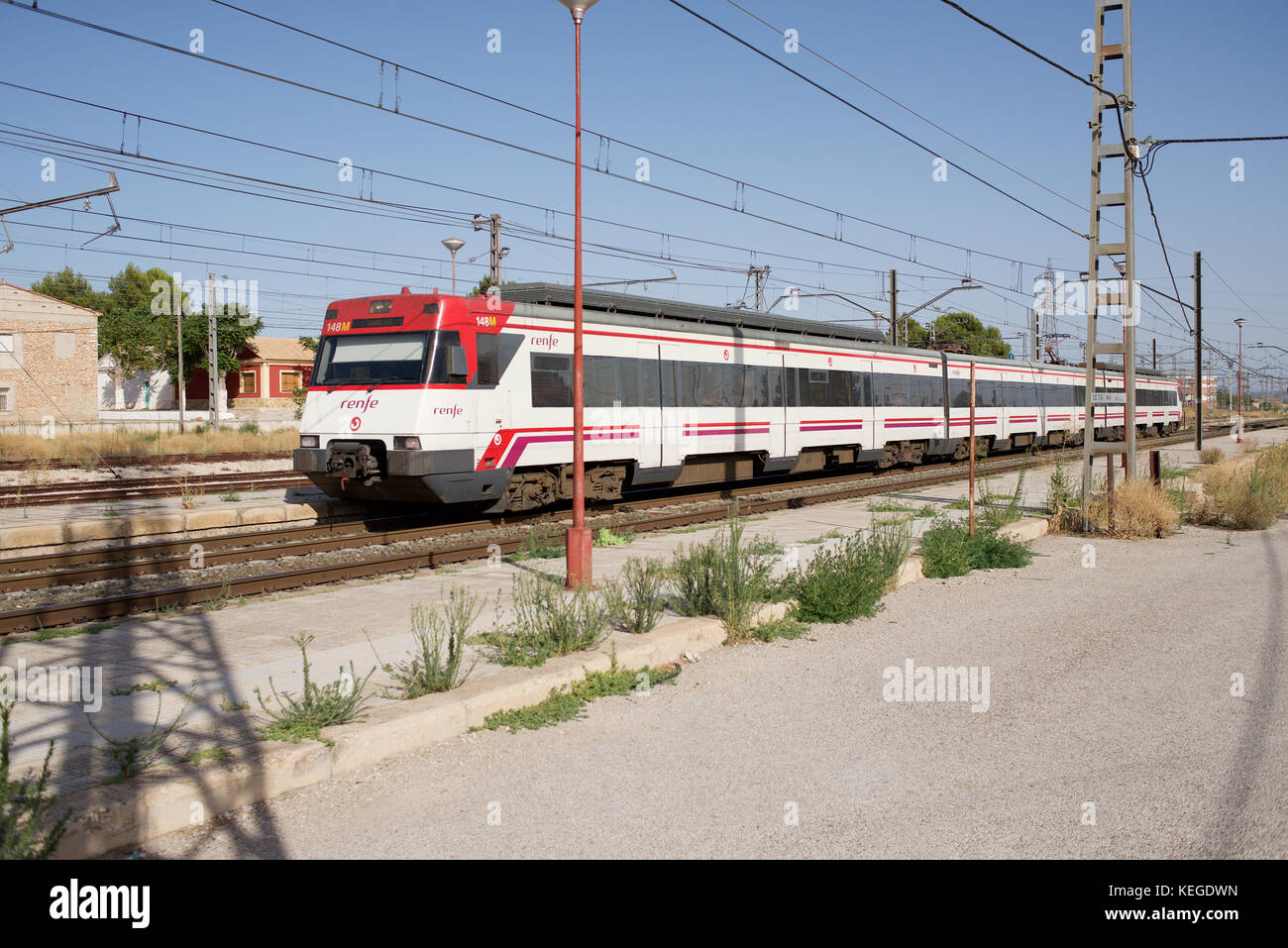 A passenger train at the railway station at La Encina, Province of ...