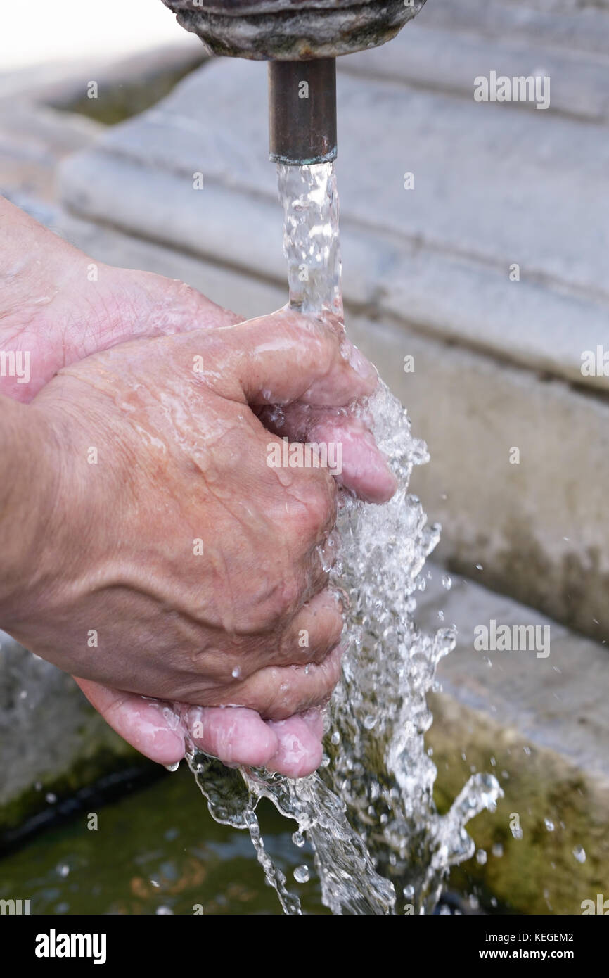 Hands water fountain hi-res stock photography and images - Alamy