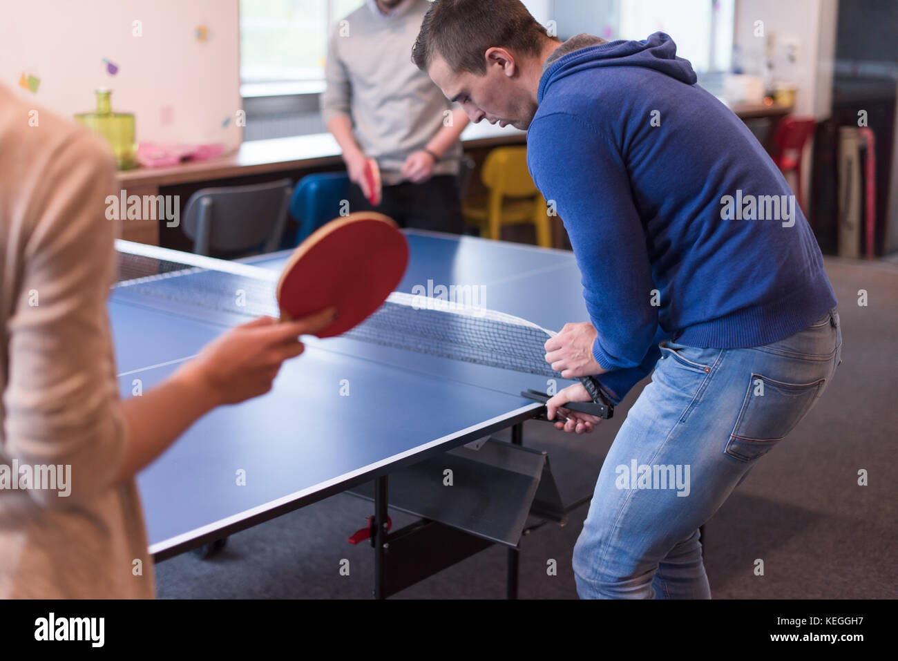 group of young startup business people playing ping pong tennis at ...