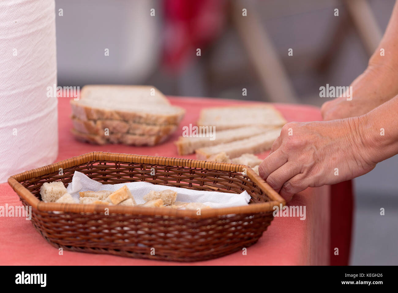 Woman cutting bread in a Spanish market. Horizontal shot Stock Photo ...