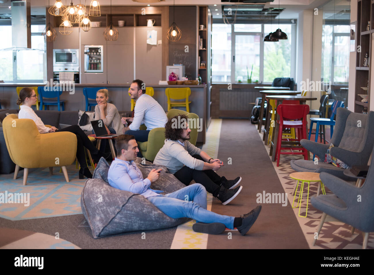 Work hard play hard. Workers Playing computer games in creative startup ...
