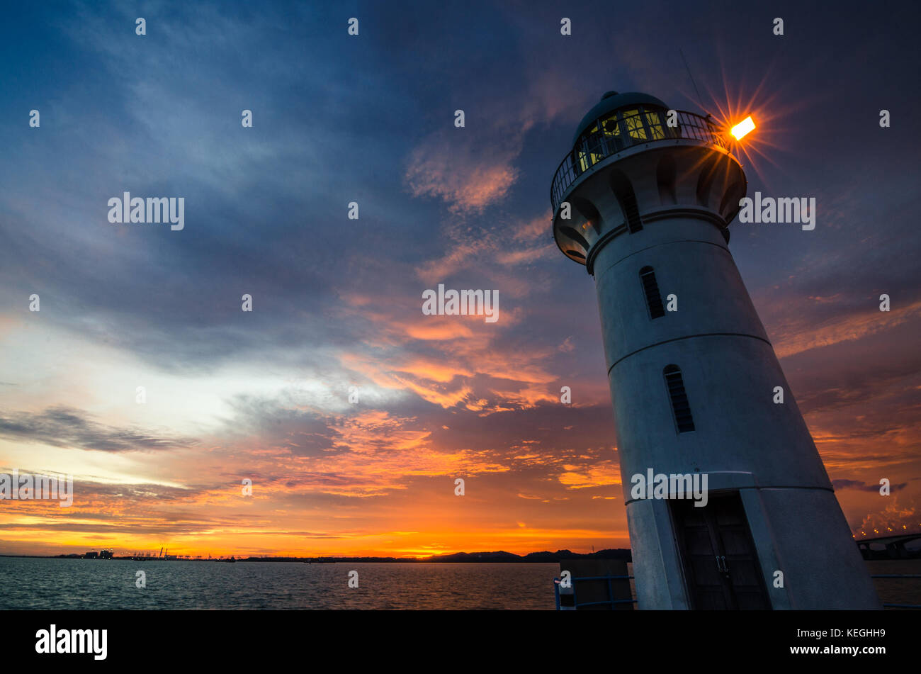 Raffles Marina Lighthouse soak in the expanse of the beautiful sunset ...