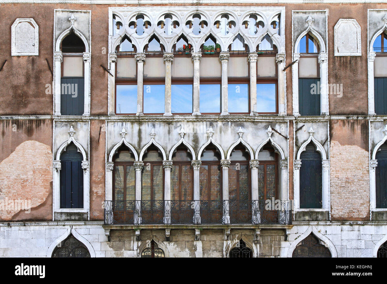 Facade of old building with tall windows Stock Photo - Alamy
