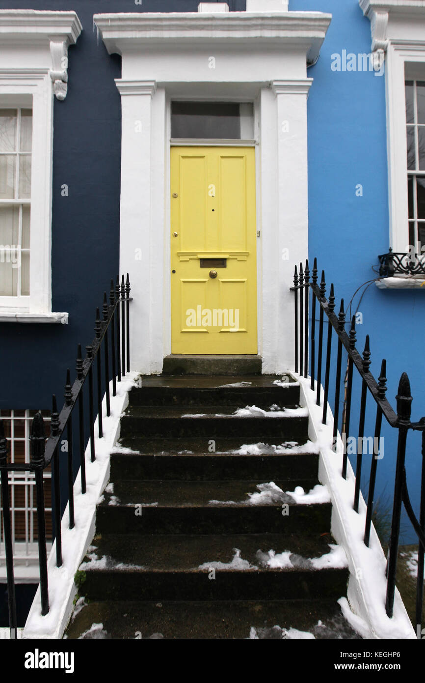 Residential house doorway with yellow entrance door Stock Photo - Alamy