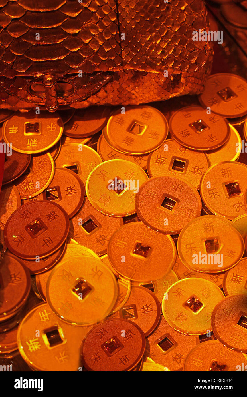 Ancient golden Chinese coins pile near gold case Stock Photo - Alamy