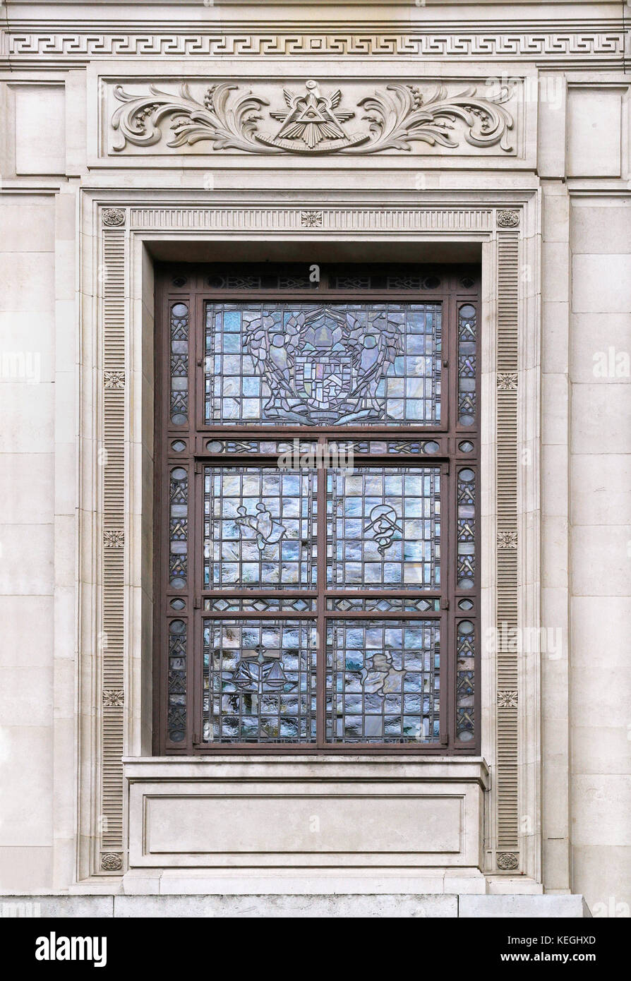Glass window on old building with stone facade Stock Photo - Alamy