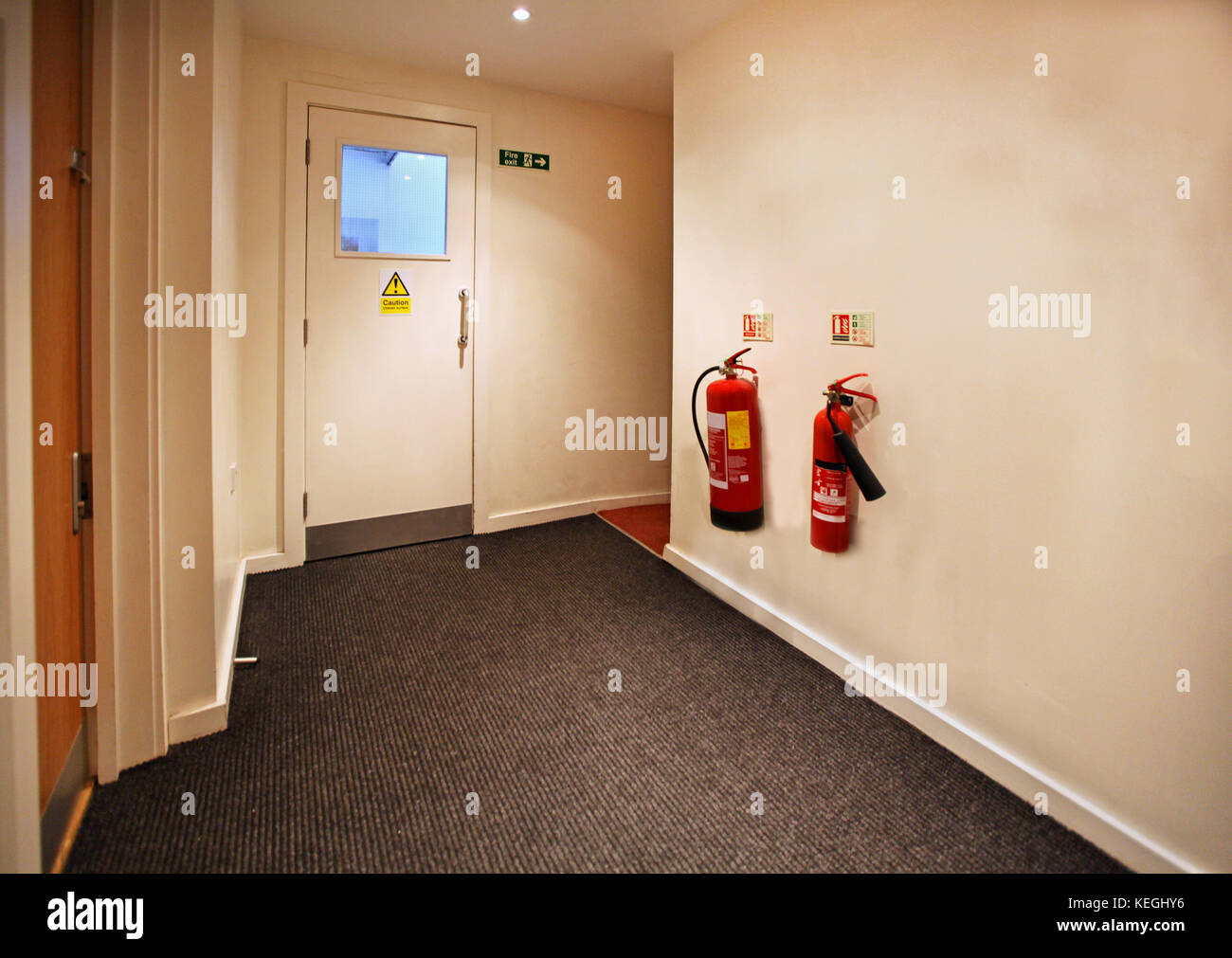 Fire exit path inside modern building interior Stock Photo - Alamy