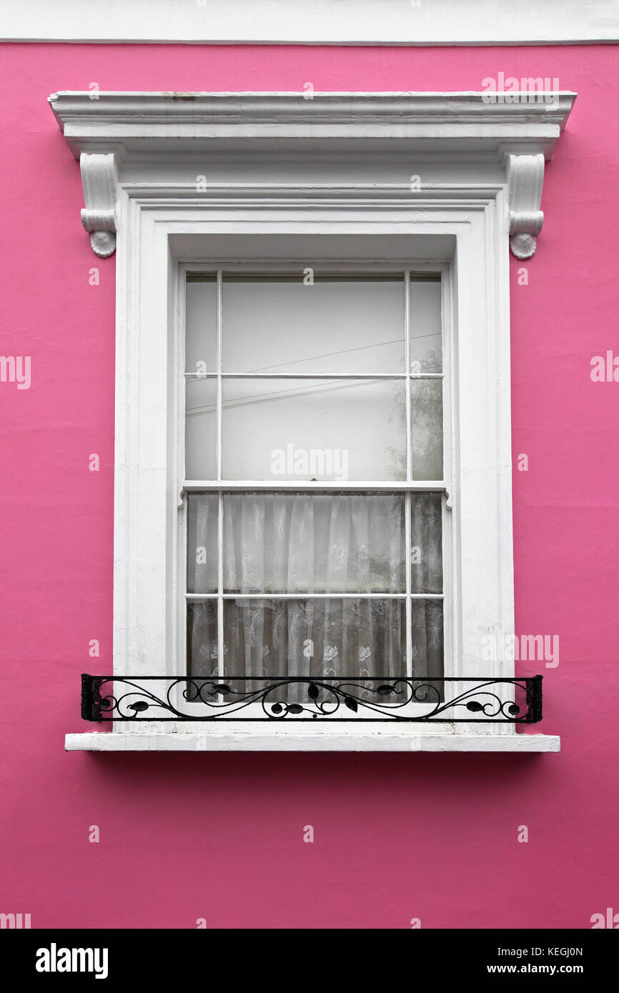 Retro window on house with pink facade Stock Photo - Alamy