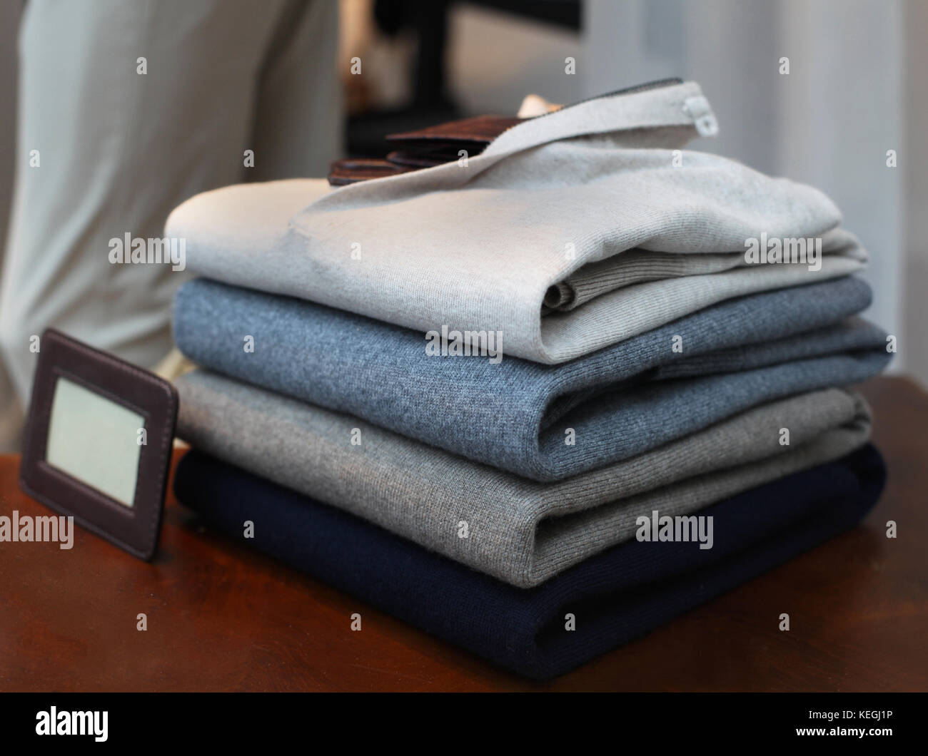 Folded jumper hi-res stock photography and images - Alamy