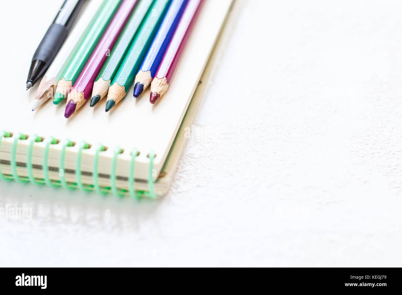 Notepad for drawing and set of pencils in natural purple green tones ...