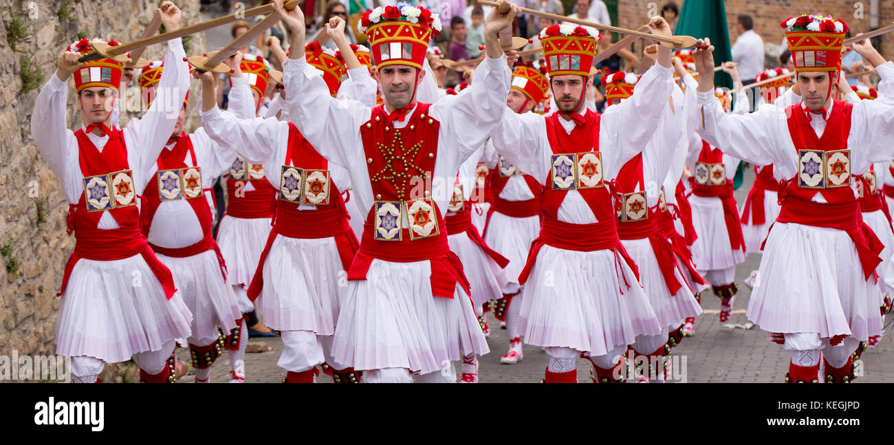 Dancers in procession through the streets during San Fermin Fiesta at ...