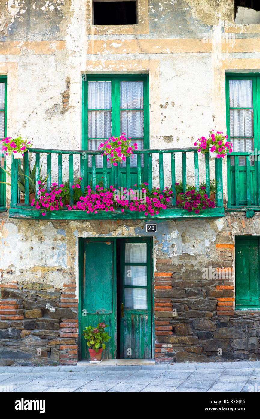 Traditional Basque architecture with geraniums in window box in the ...