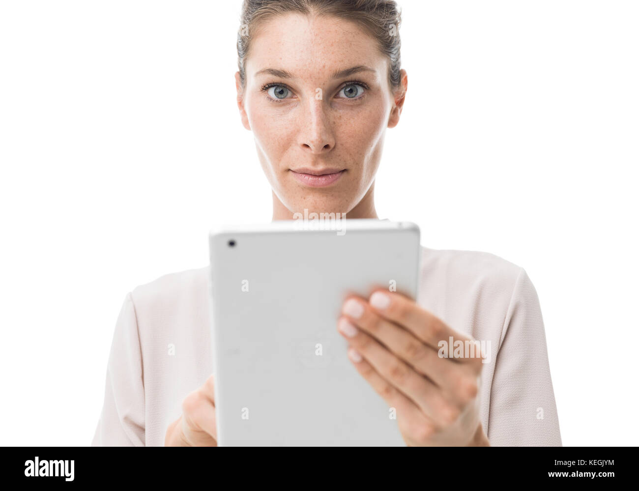 Young attractive woman connecting with a digital touch screen tablet ...