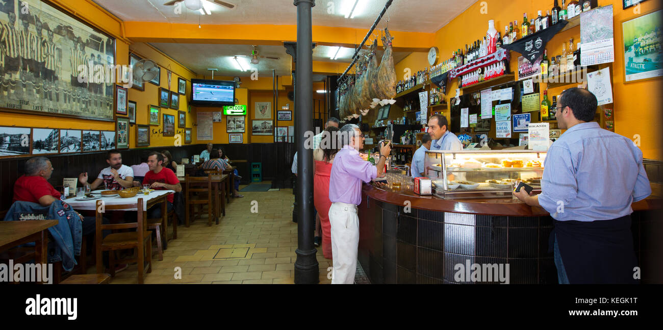 Locals in traditional Spanish tapas raciones Bar Restaurante Bikandi in ...
