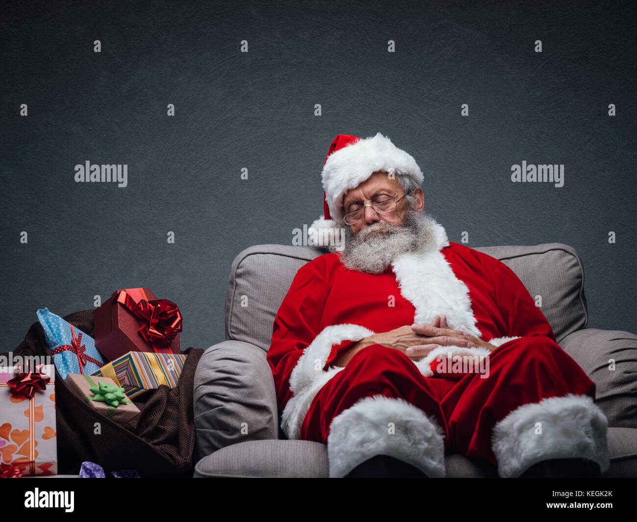 Sleepy Santa Claus taking a nap and relaxing on the armchair on ...